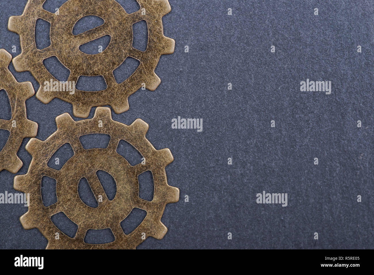 Old vintage antique hour metal gears on natural stone background Stock ...