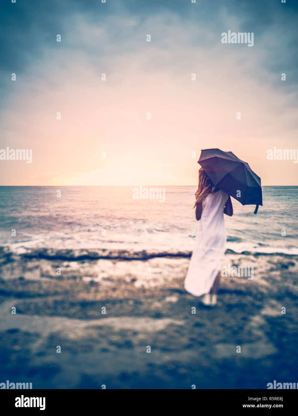 Woman alone sad beach summer back hi-res stock photography and images ...