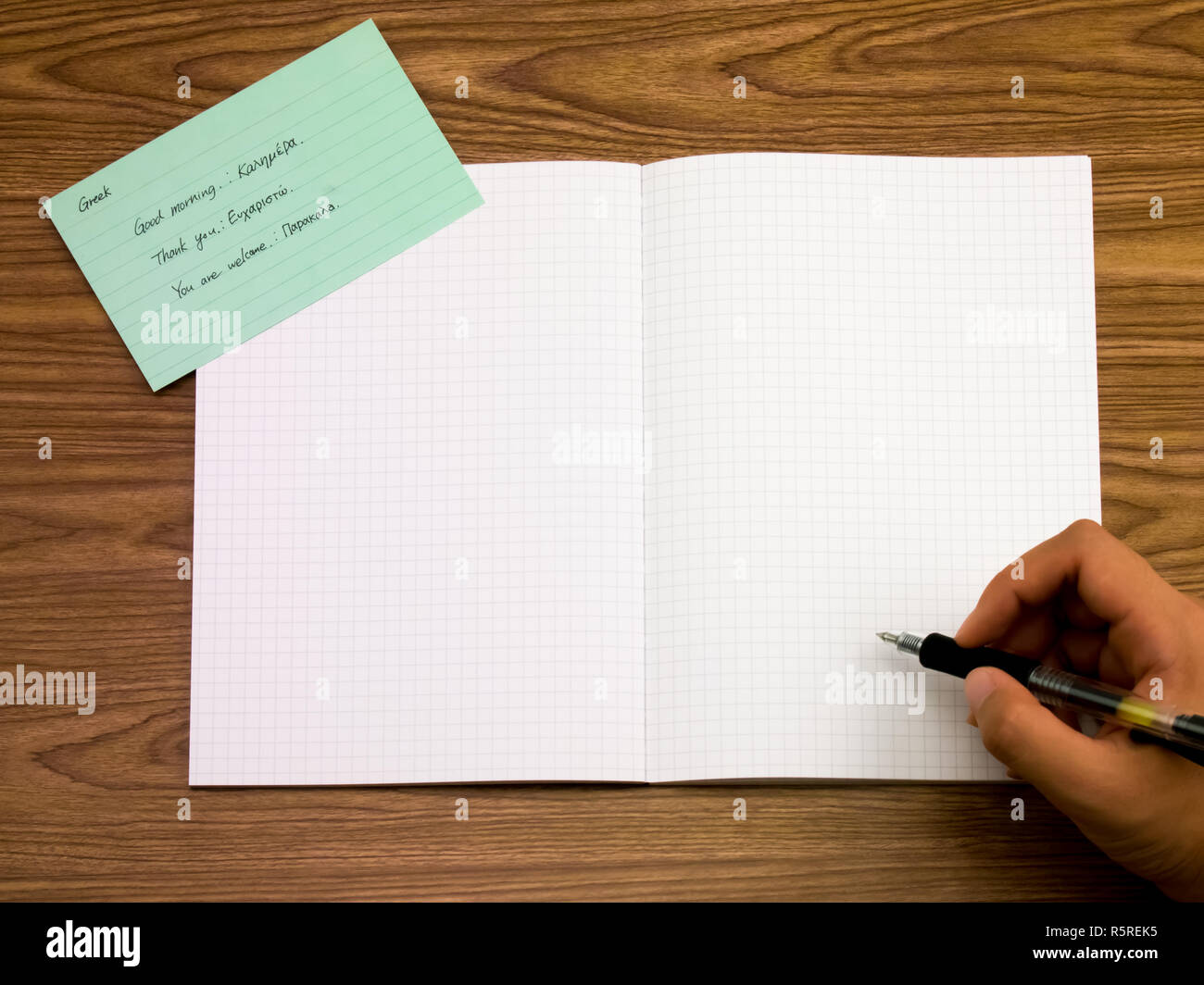 Greek Learning New Language Writing Words on the Notebook Stock Photo ...