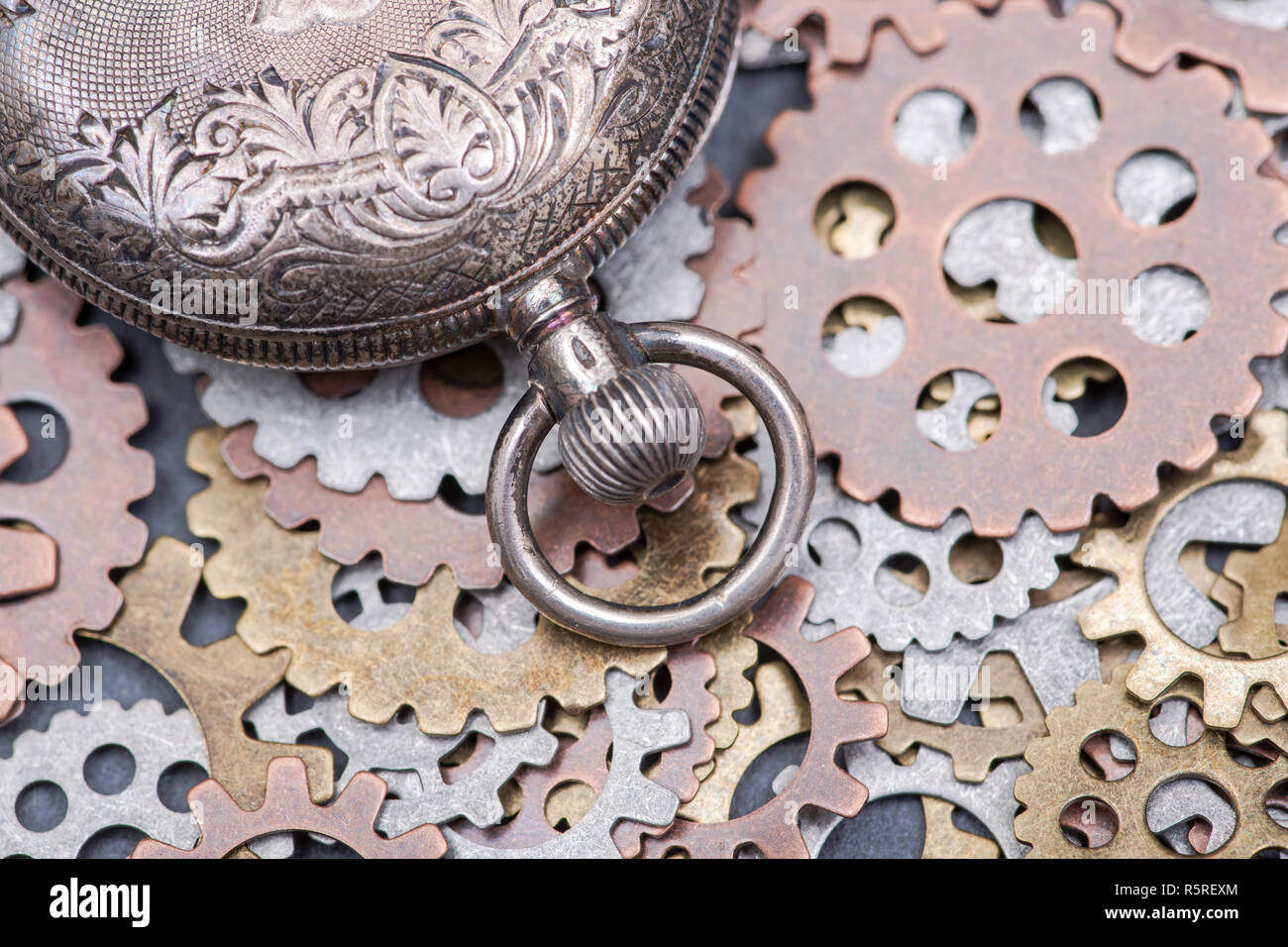 Antique pocket watch and old vintage hour metallic gears on natural ...