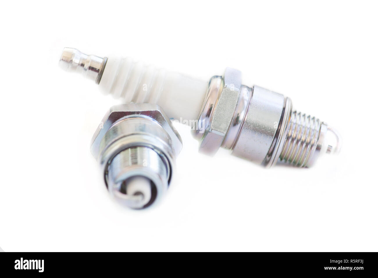 Two spark plugs on white Stock Photo - Alamy