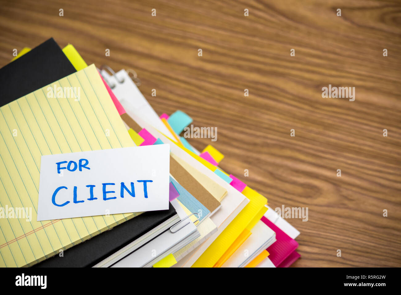 For Client The Pile of Business Documents on the Desk Stock Photo - Alamy