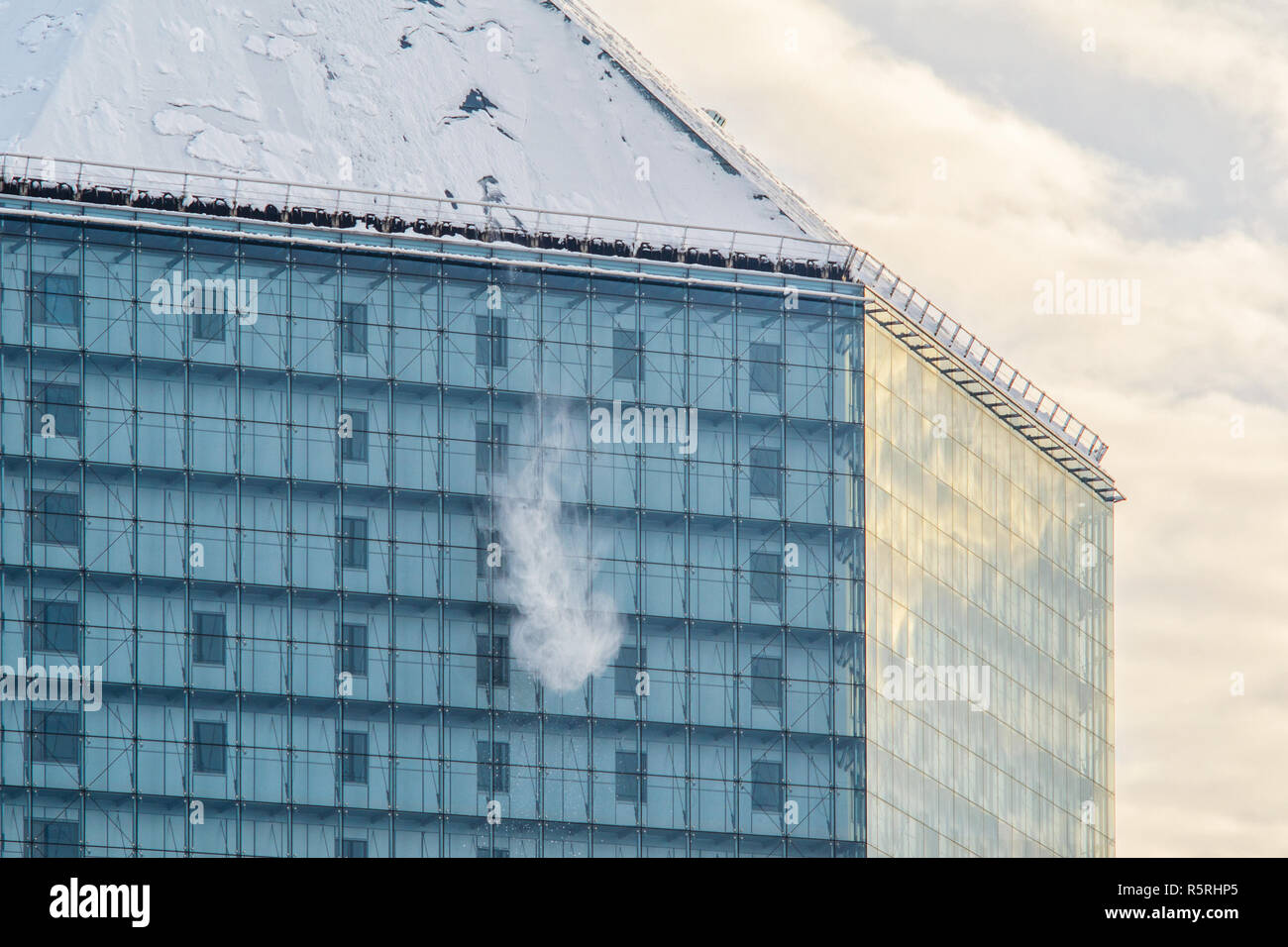 Snow fall from the roof. Sloping glass facade wall winter problems ...