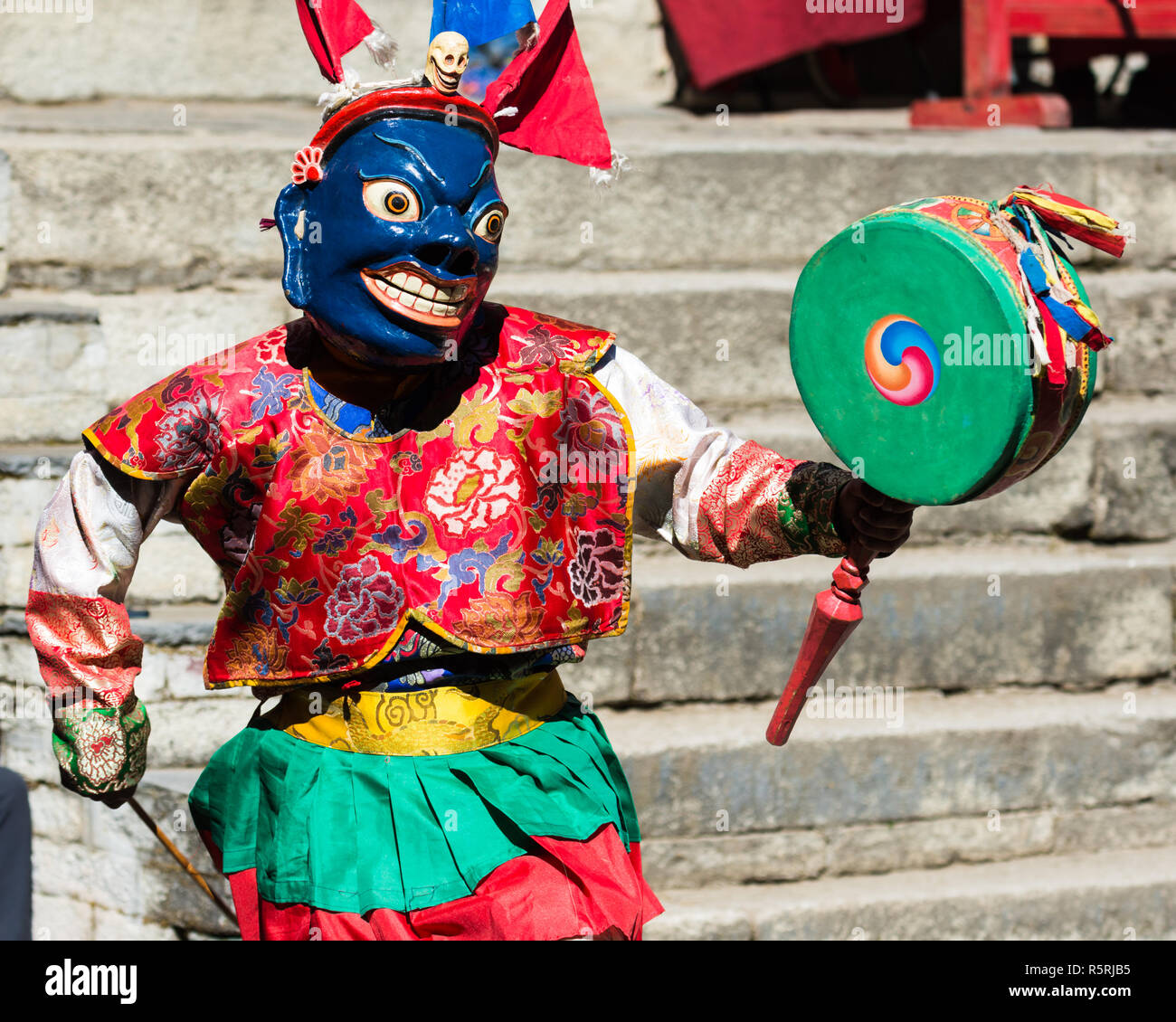 Female Ghing with drums performing the Ghing-Pa masked dance at Mani ...
