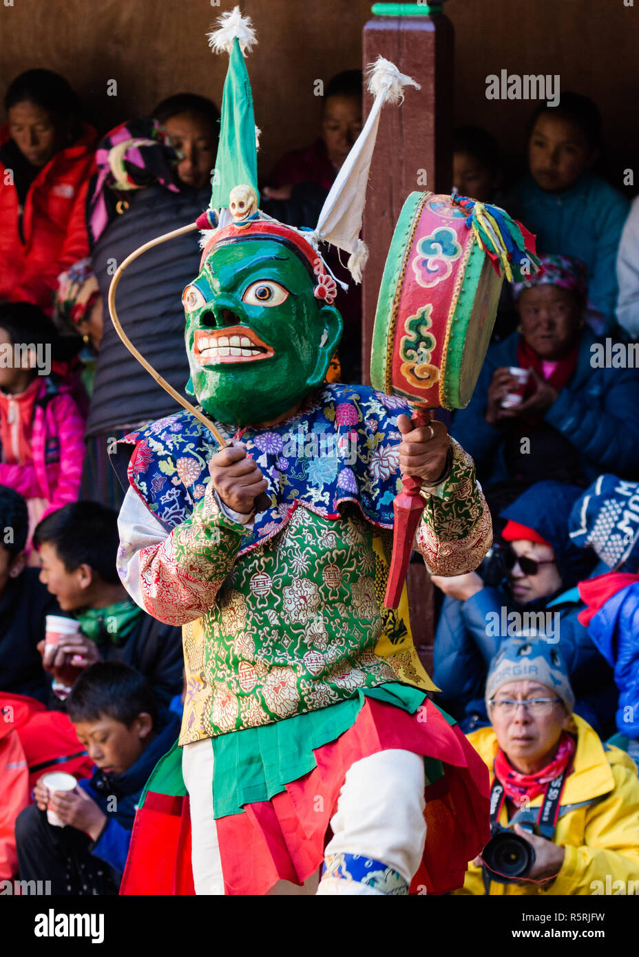 Female Ghing with drums performing the Ghing-Pa masked dance at Mani ...