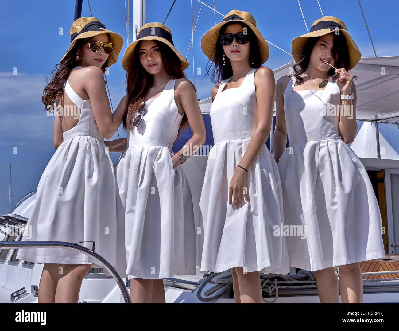 Promotion girls. Models posing on a luxury yacht at the Pattaya boat ...