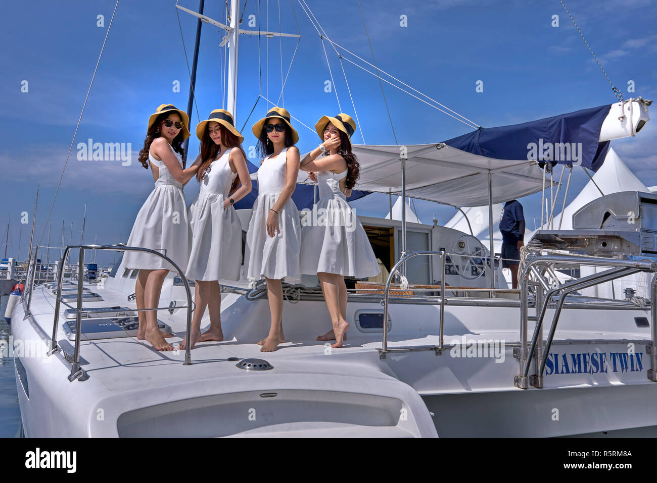 Promotion girls. Models posing on a luxury yacht at the Pattaya boat ...