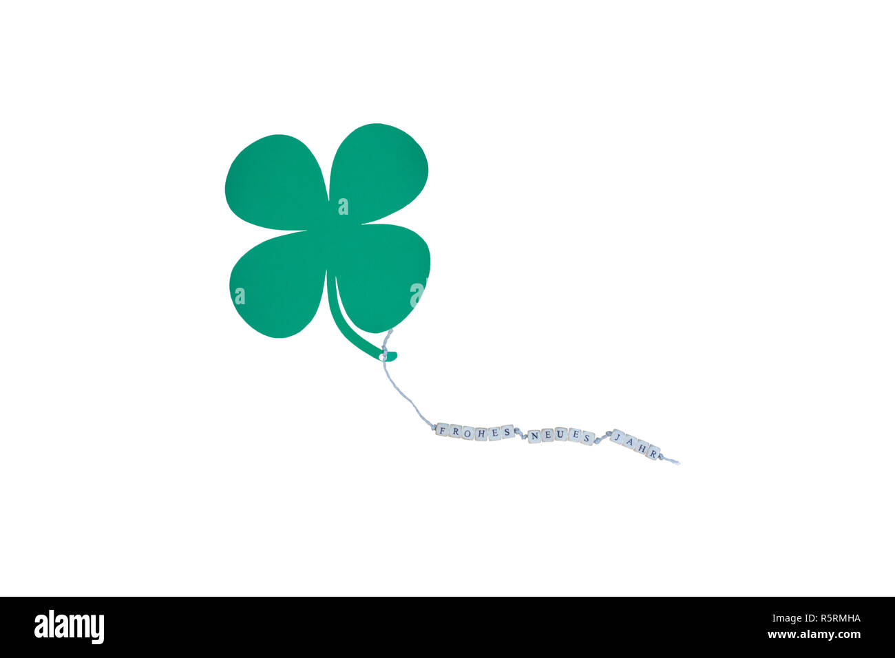 the words happy new year and a shamrock on a drawstring,cut out Stock ...