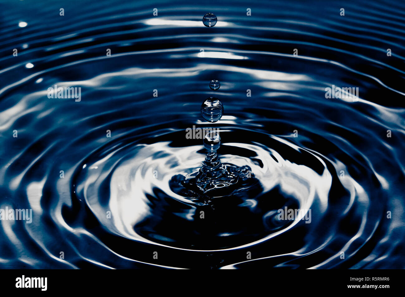 Water drop falling Stock Photo - Alamy