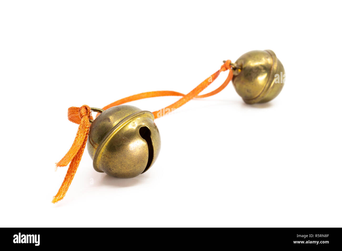 Musical instrument - Two copper sleigh bells tied with an orange ribbon ...