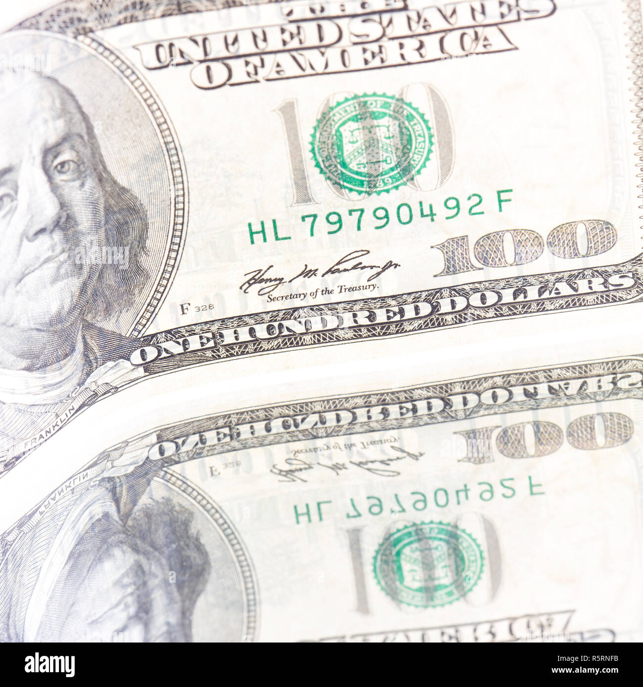 blurred dollar money background and mirror like concept of success ...