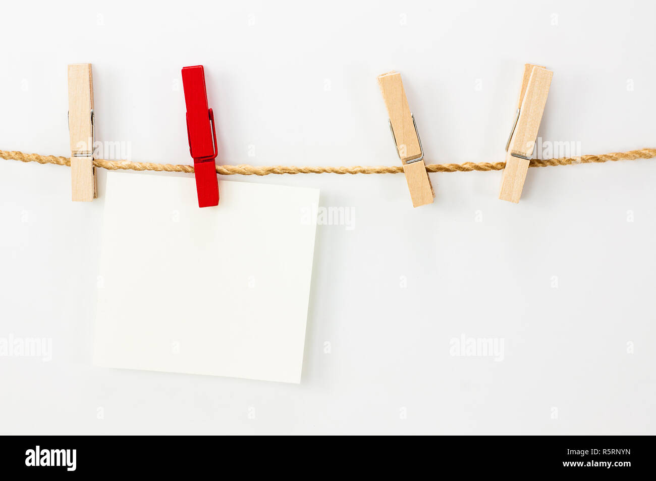 Notice card, white paper and wood clips on white background Stock Photo ...