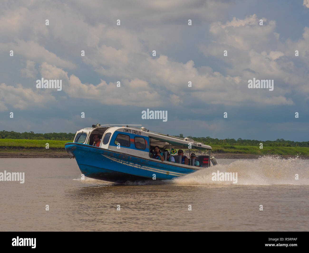 Amazon River, Brazil: - Sep 15, 018: Speed boat with locals on the ...