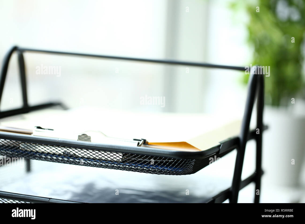 Black metallic multilevel office document tray Stock Photo - Alamy