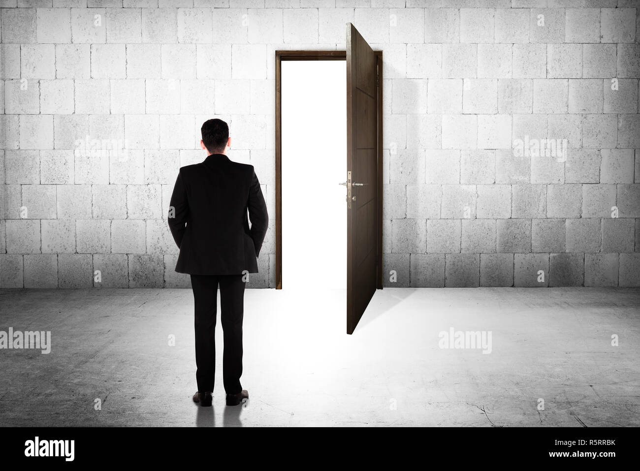 Business man going to the open door Stock Photo - Alamy