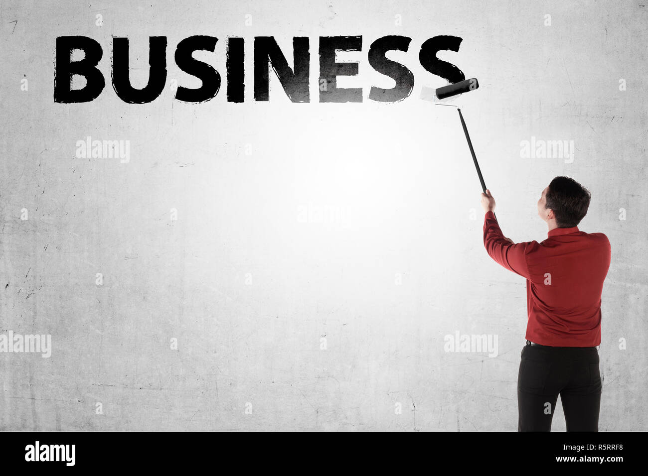 Business man paint business word Stock Photo - Alamy