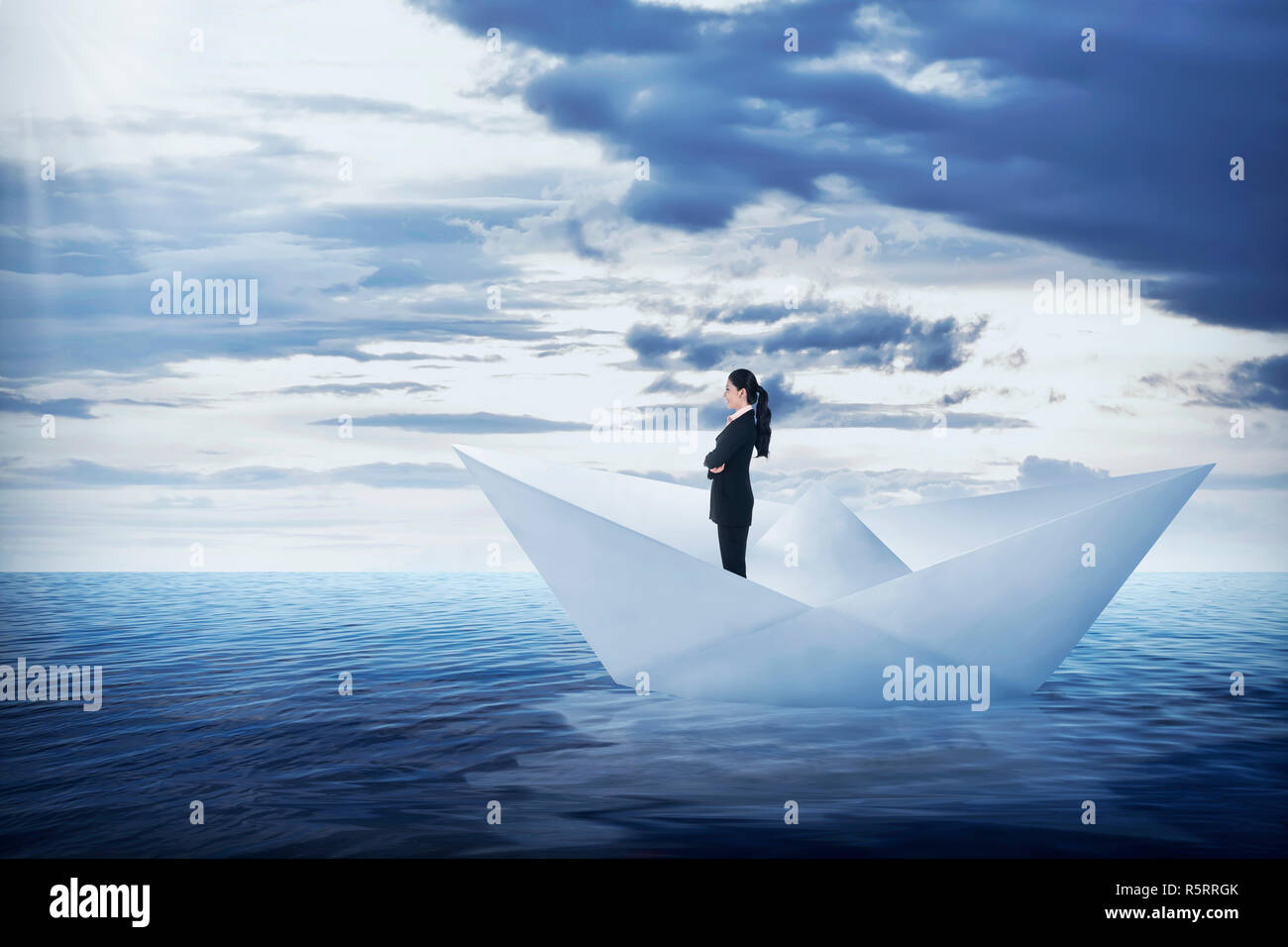 Asian business woman standing on the paperboard Stock Photo - Alamy