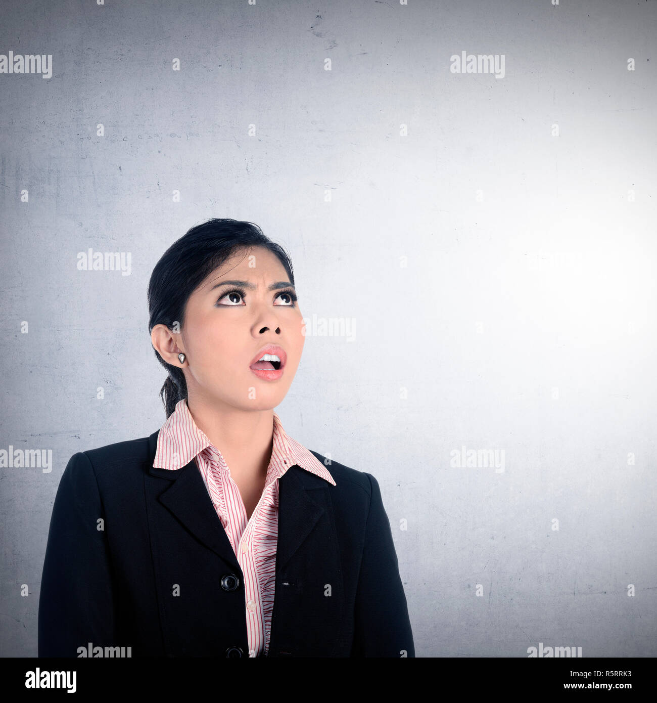 Asian business woman get shocked Stock Photo - Alamy