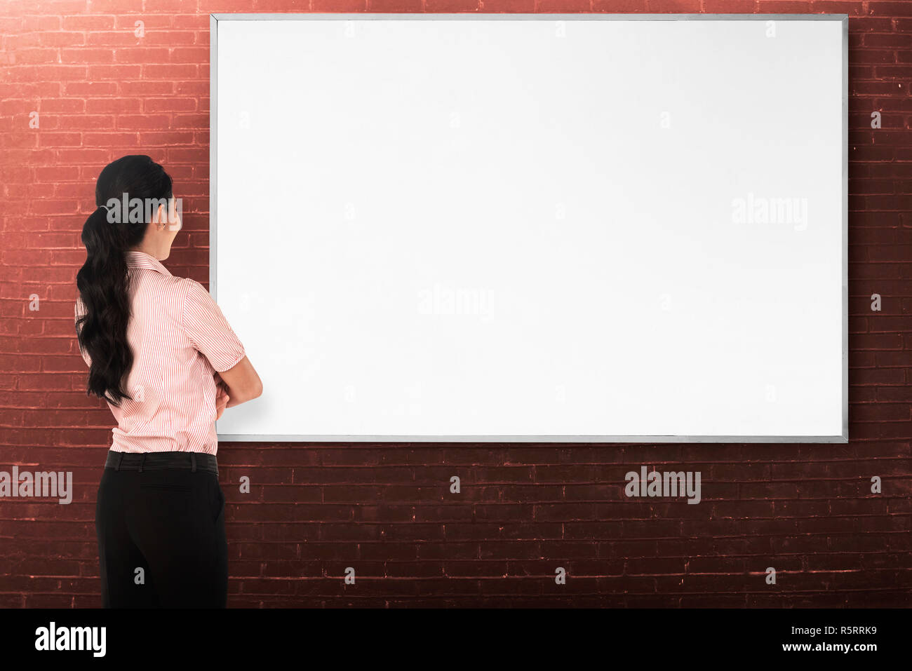 Back view young woman with white board Stock Photo - Alamy