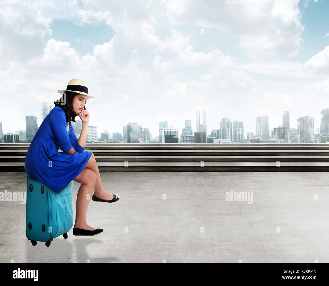 Asian young woman traveler with sad face, sitting on the suitcase Stock ...