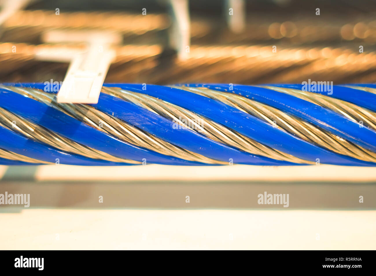 Industrial with coiled steel cable Stock Photo - Alamy