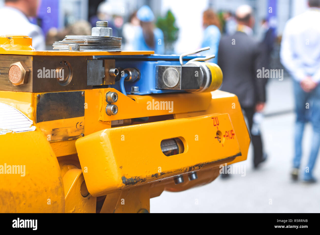 The hydraulic tractor is yellow. Crawler bulldozer at the exhibition ...