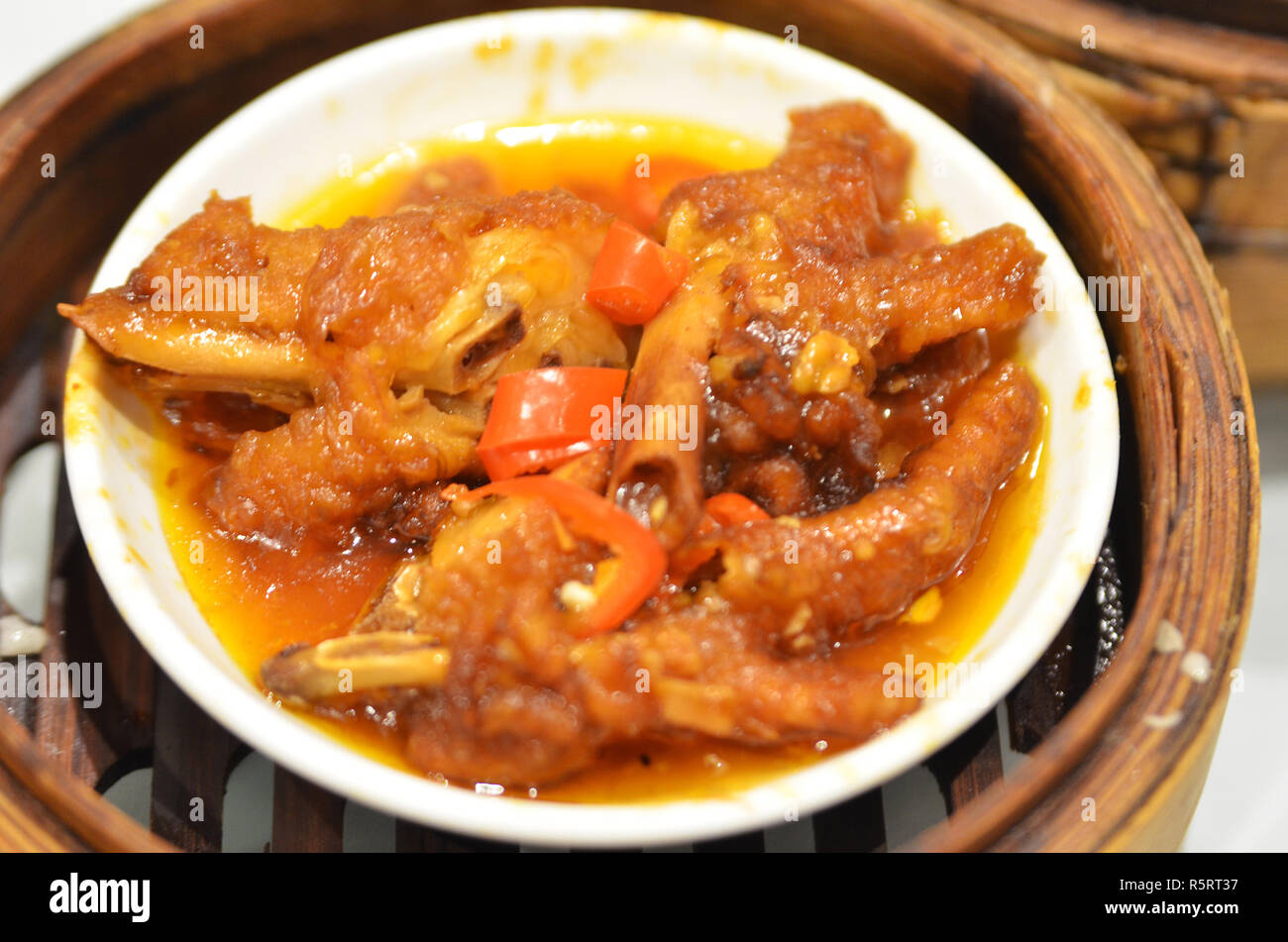 Steamed chicken feet dim sum Stock Photo - Alamy