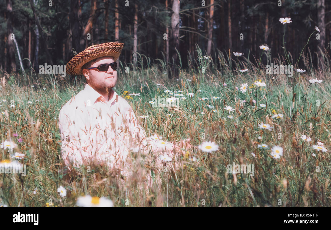 Man Rest On The Forest Lawn Stock Photo - Alamy