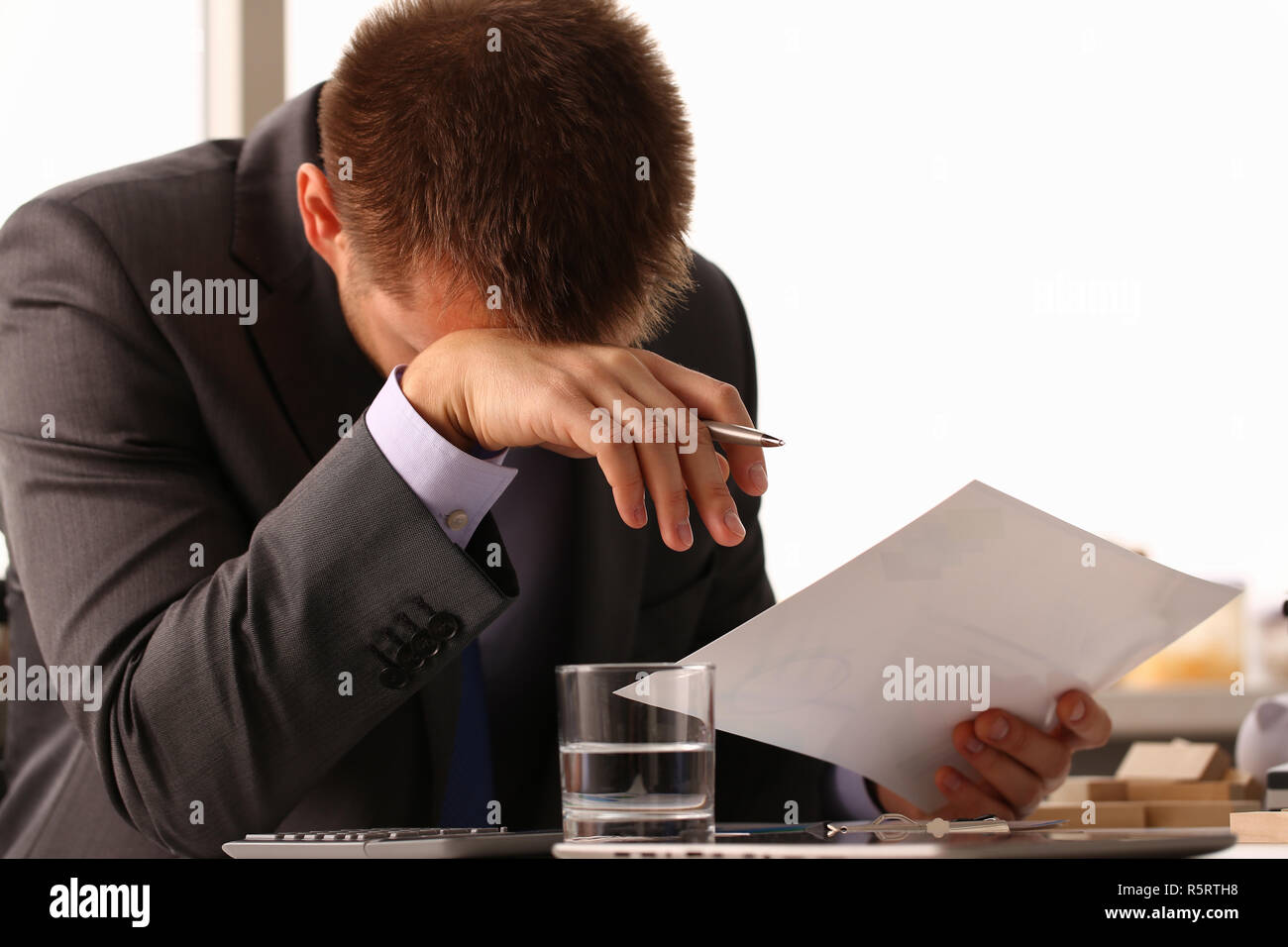 Unhappy man sheet paper hi-res stock photography and images - Alamy