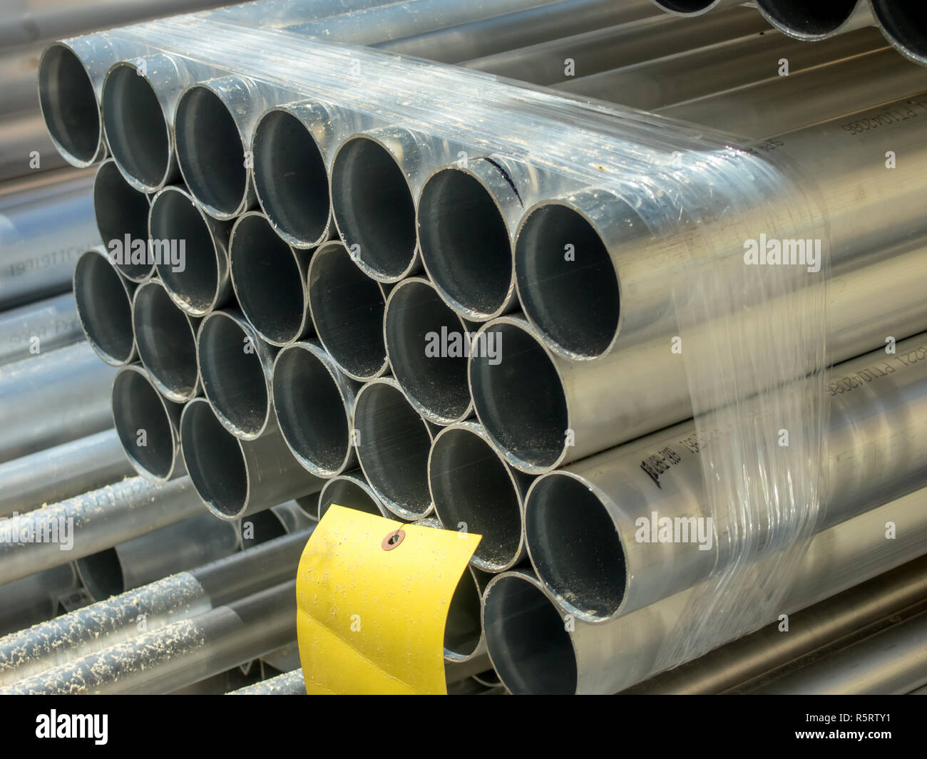 Stack of Many Pipes at the Construction Site Stock Photo - Alamy