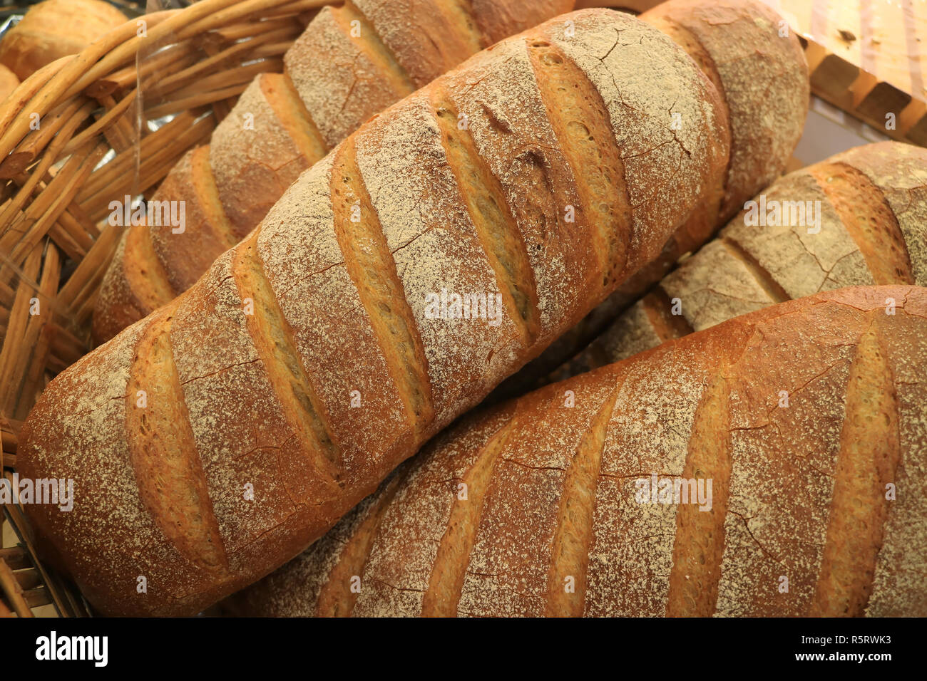 Pile of Fresh Made Whole Wheat Bread Loaves in a Basket Stock Photo - Alamy