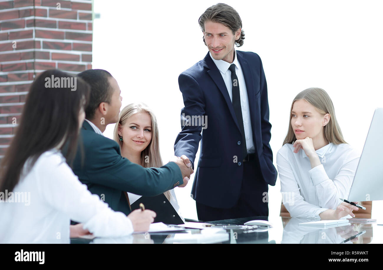 handshake Manager and customer in a modern office Stock Photo - Alamy