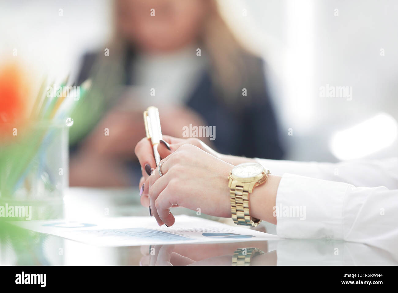 close up.modern business woman sitting at work Desk Stock Photo - Alamy