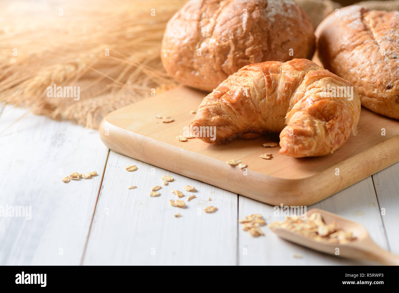 Homemade croissant and bread on old wood background, fresh bakery Stock ...