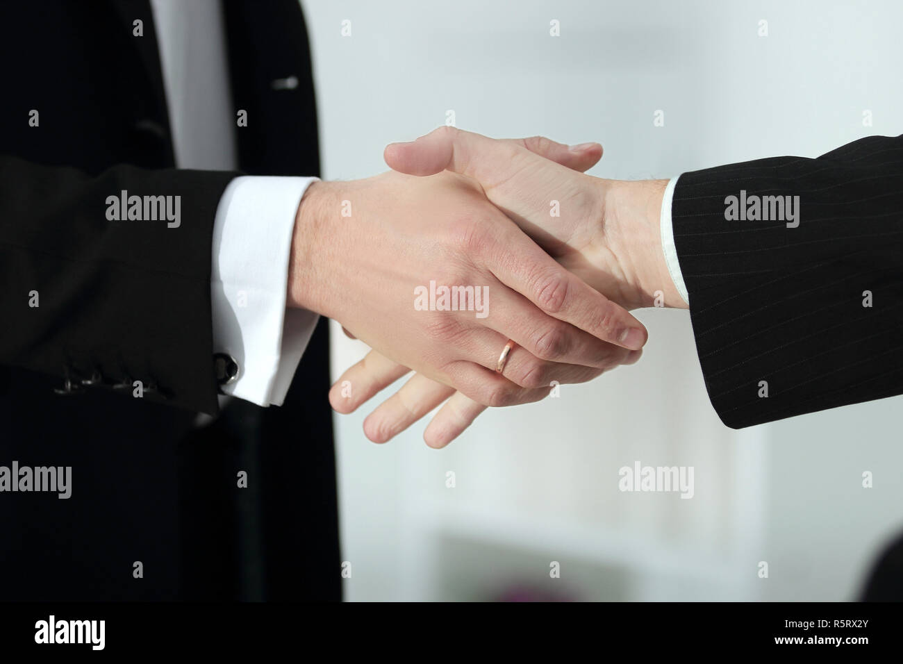 close up. handshake of trading partners on blurred office background ...
