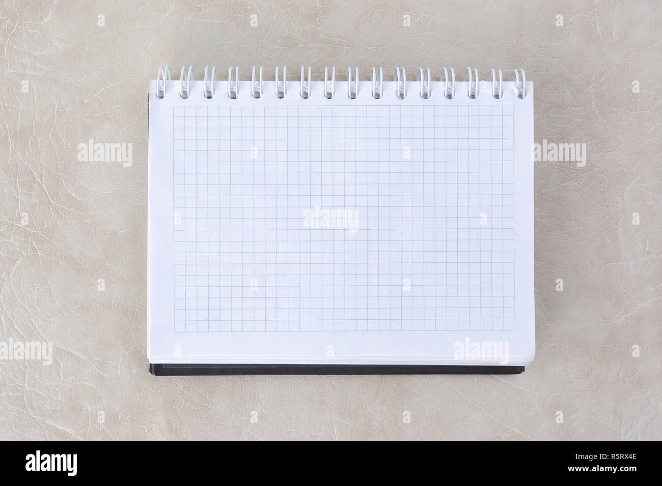 open notebook with spiral, on paper background.photo with copy space ...
