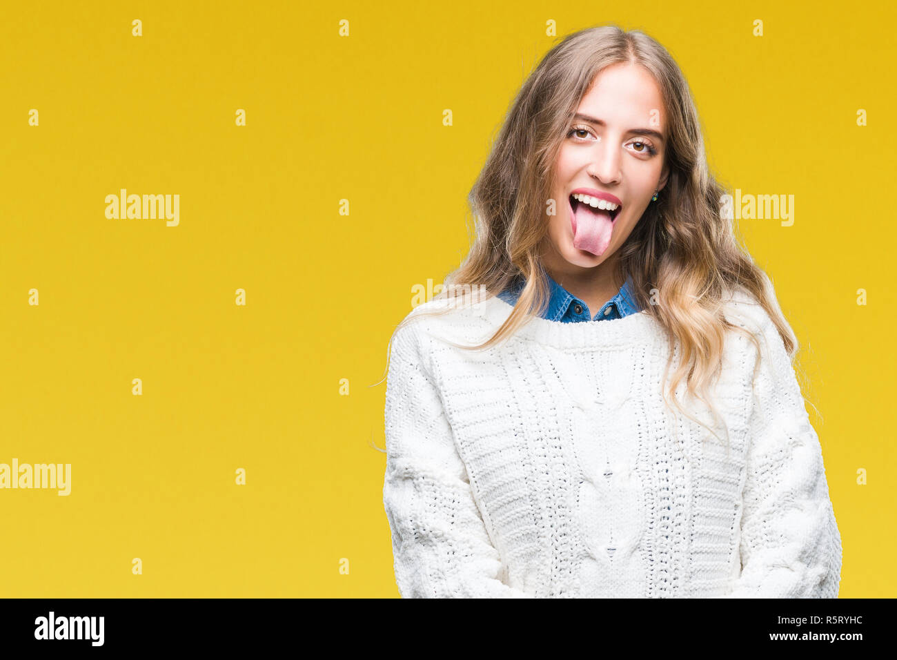 Beautiful young blonde woman wearing winter sweater over isolated ...