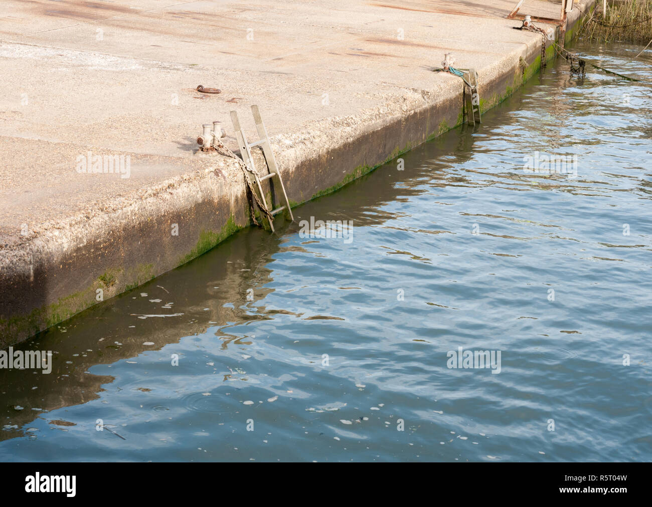marina dock ladder empty no people high tide Stock Photo - Alamy