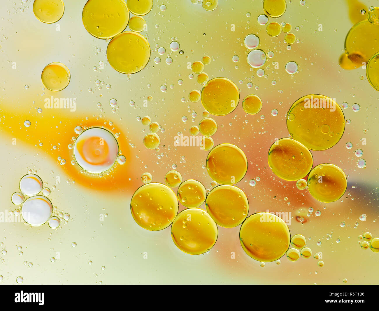 Oil drops on a water surface Stock Photo - Alamy