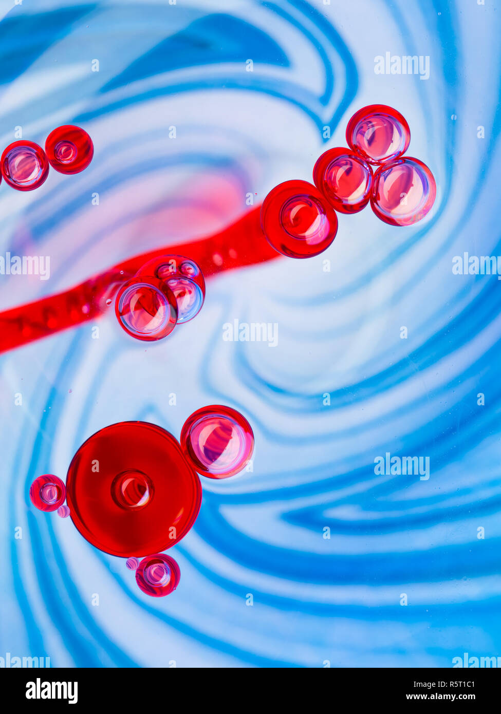 injecting red oil drops Stock Photo - Alamy