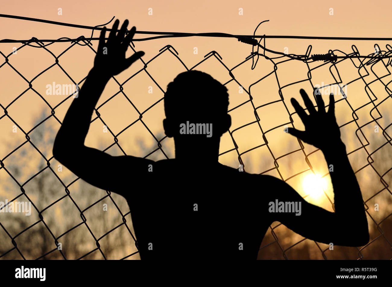 Wire fencing man hi-res stock photography and images - Alamy