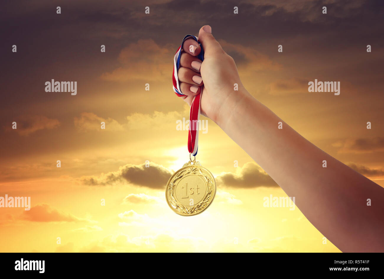Woman hand raised gold medal hi-res stock photography and images - Alamy