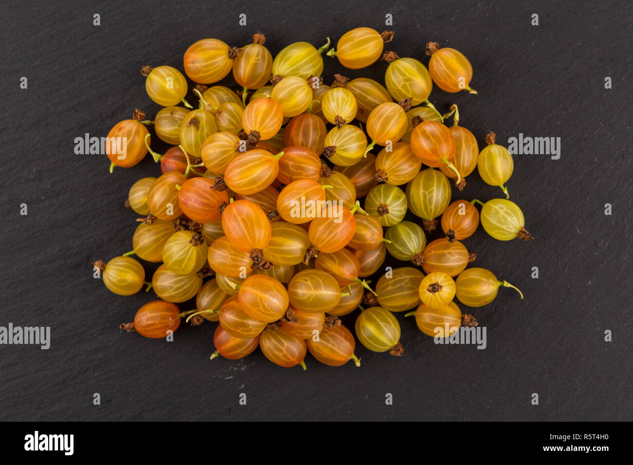 gooseberry on stone Stock Photo - Alamy