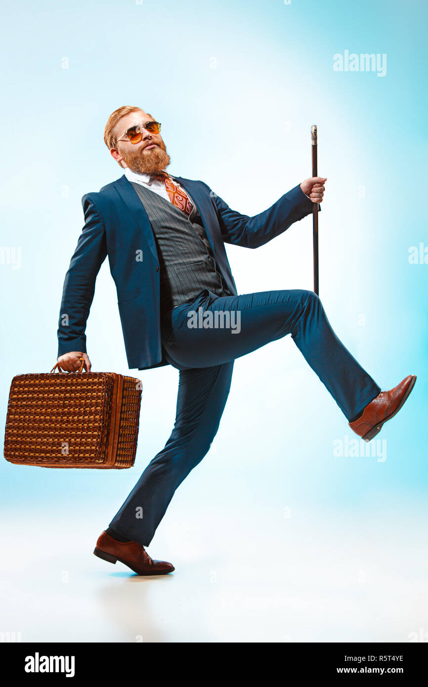 The barded man in a suit holding cane Stock Photo - Alamy