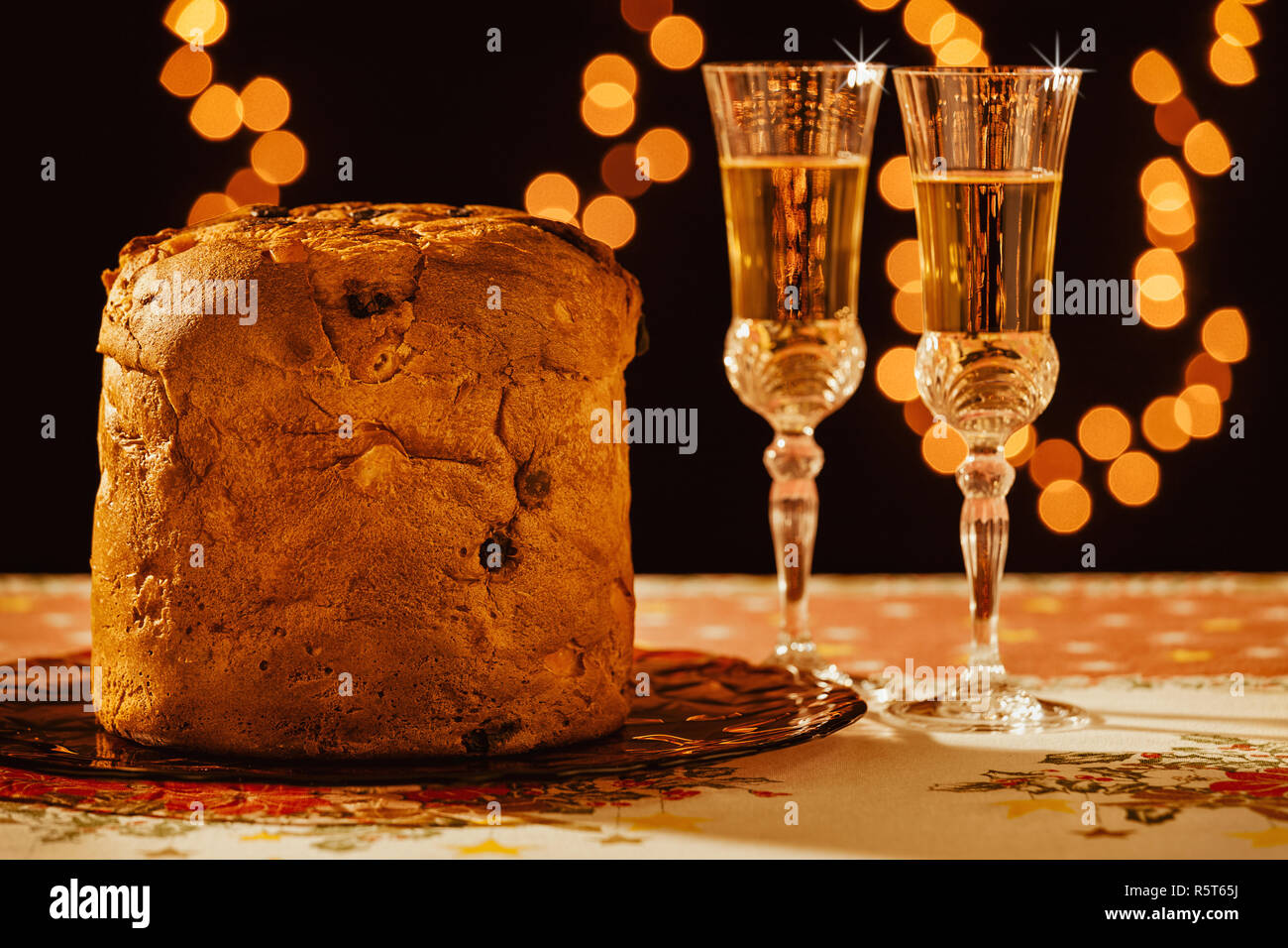 Italian panettone and sparkling wine over a table Stock Photo - Alamy