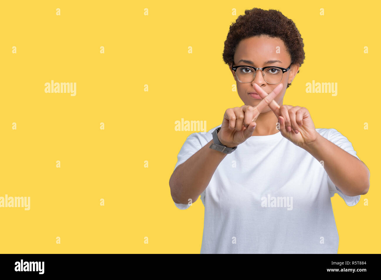 Beautiful young african american woman wearing glasses over isolated ...