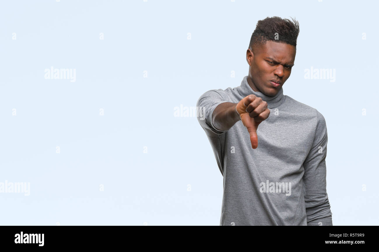 Young african american man over isolated background looking unhappy and ...