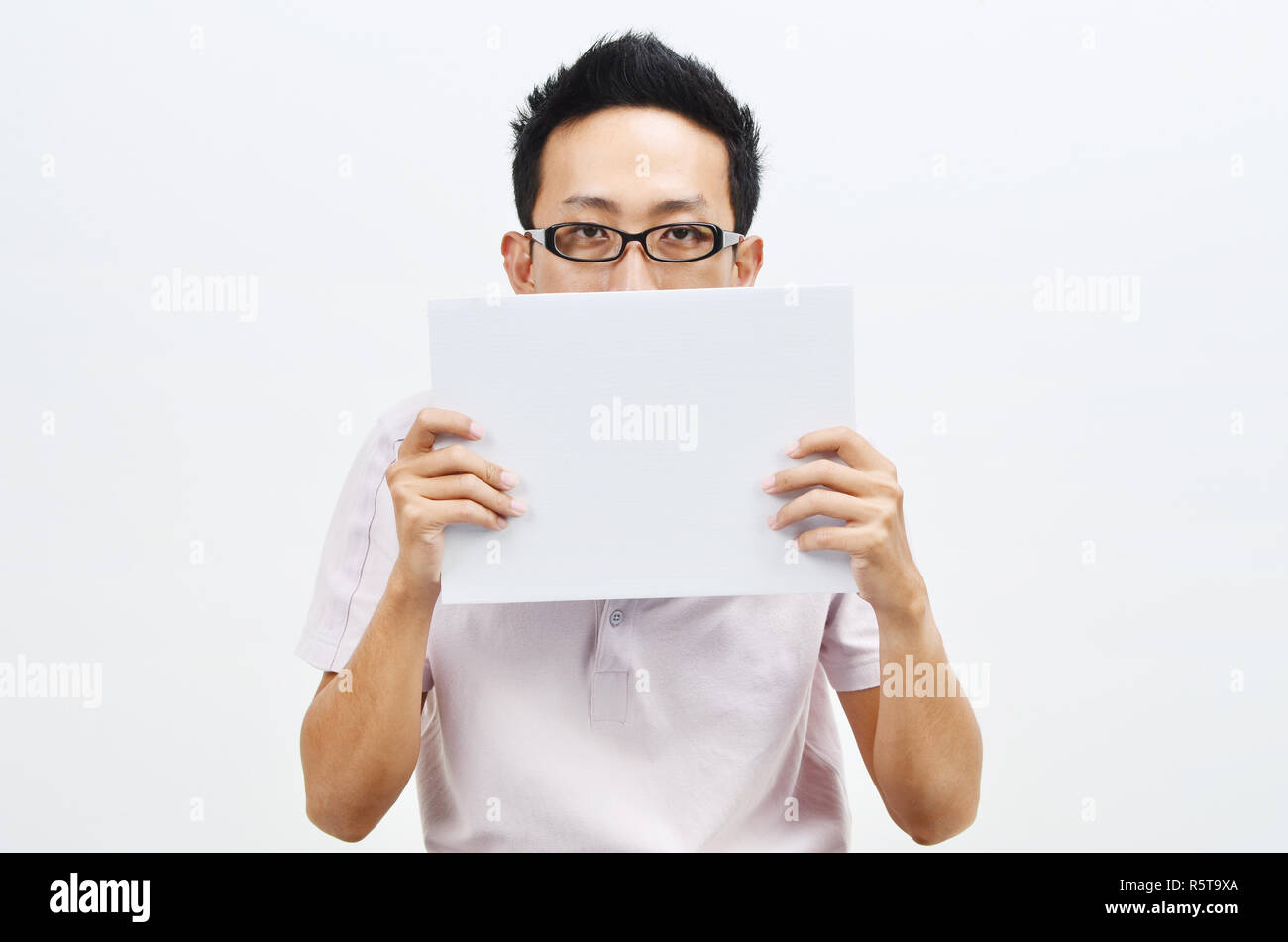 Asian man holding white paper card covering face Stock Photo - Alamy
