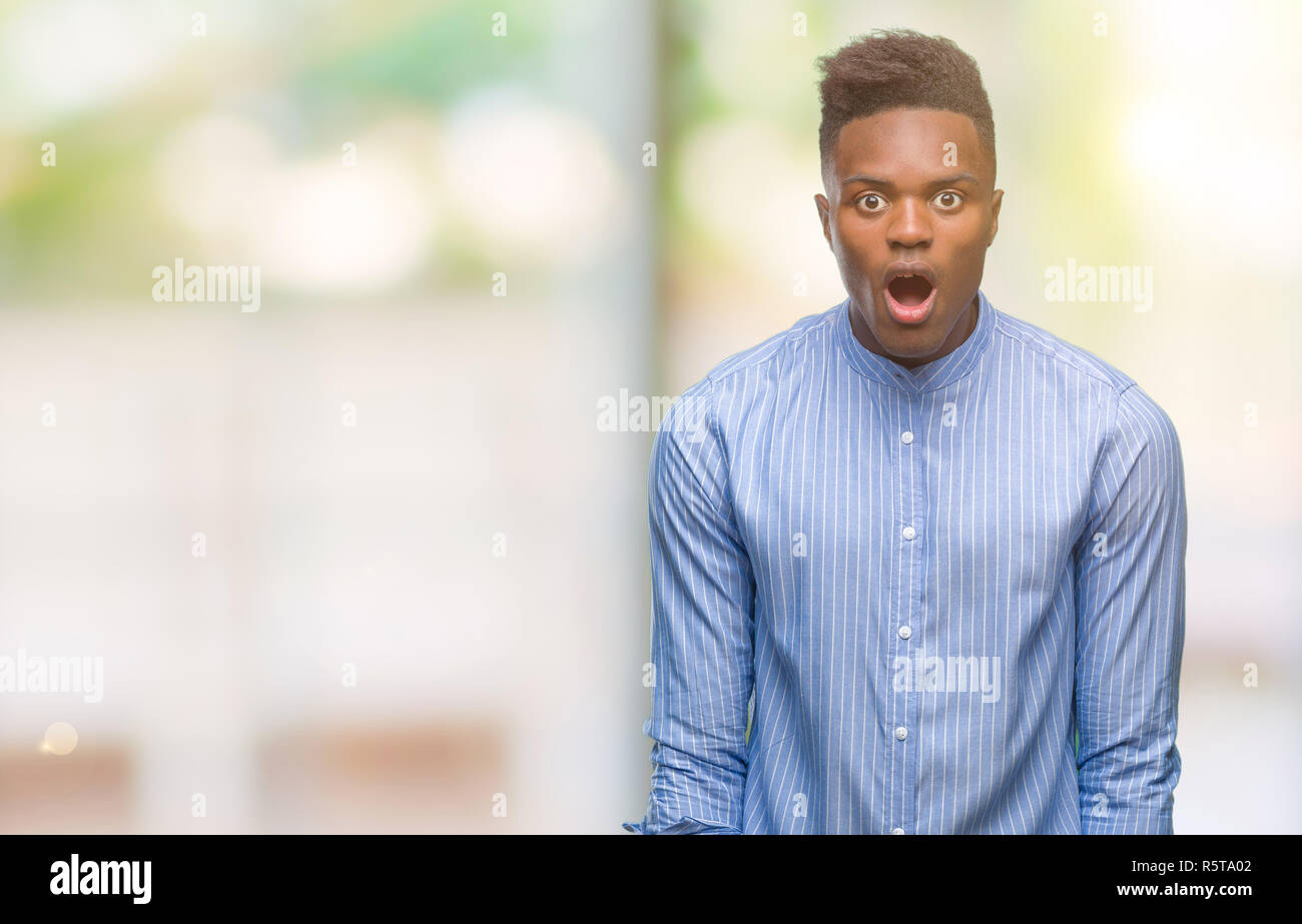 Young african american business man over isolated background afraid and ...
