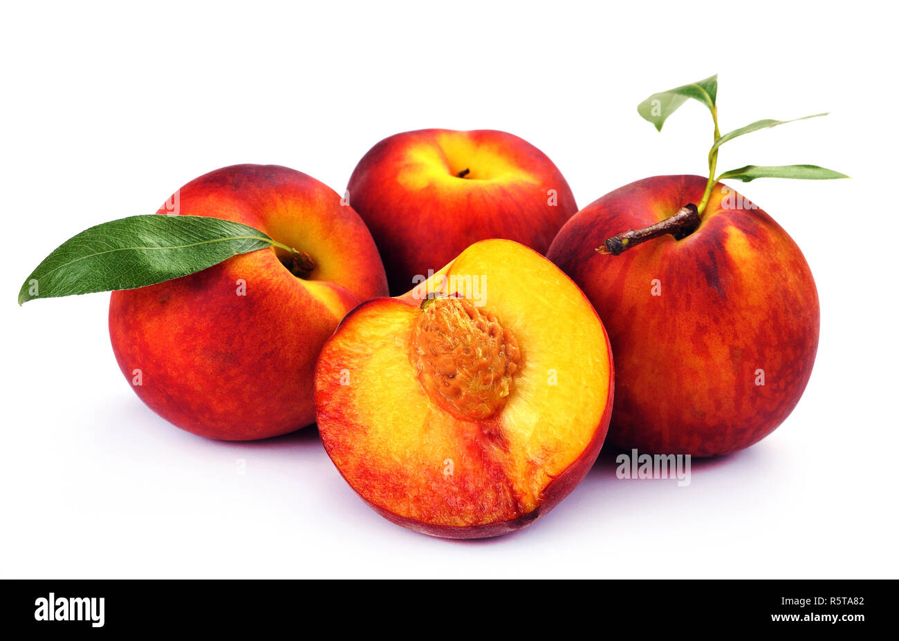 Fresh peach with green leaf isolated on white background. Peach in a ...